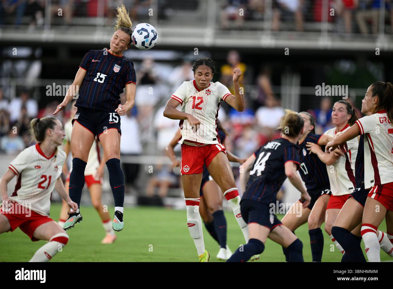 United States midfielder Claire Hutton (15) heads the ball against ...