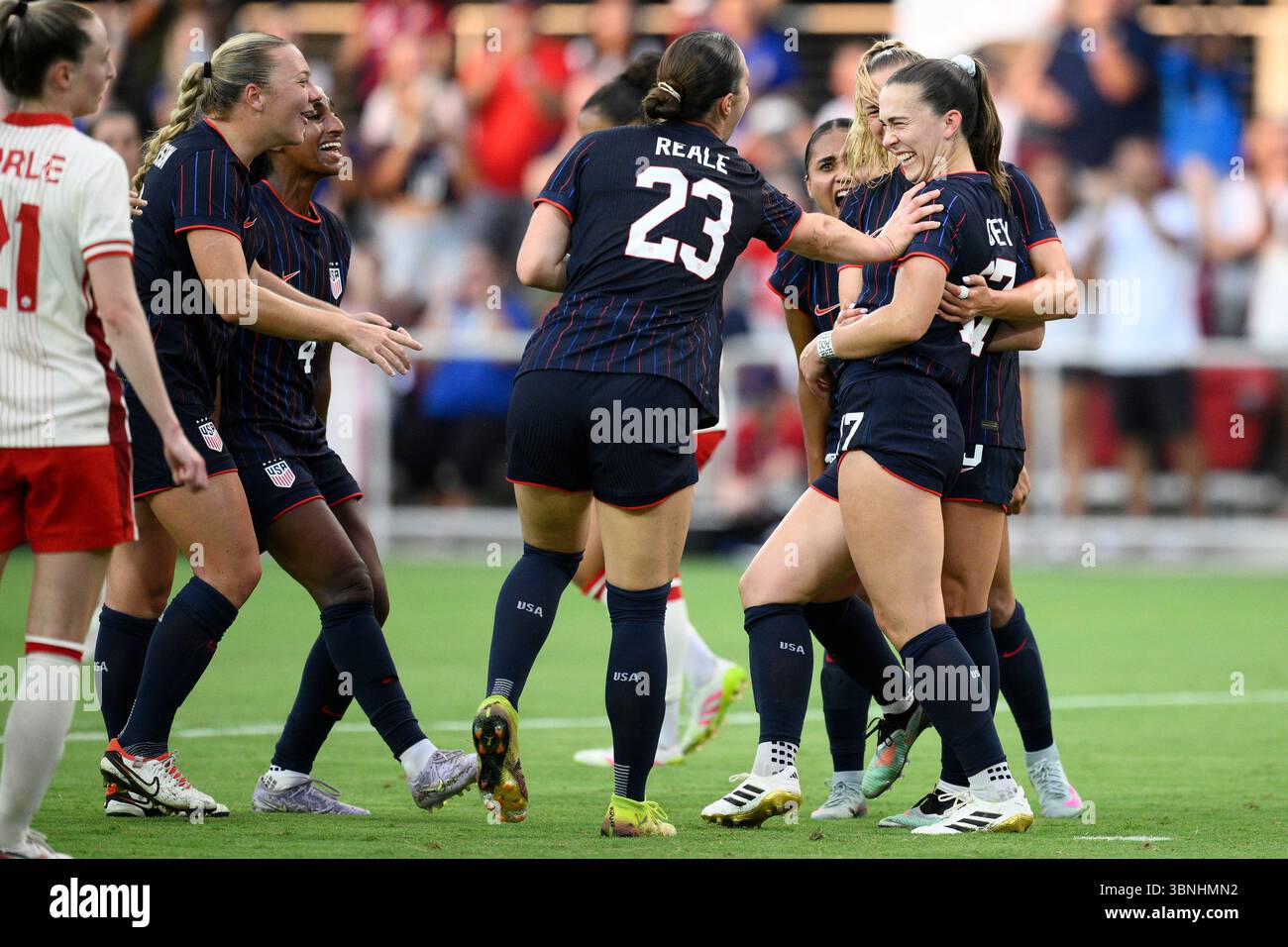 United States forward Sam Coffey, right, celebrates her goal with ...