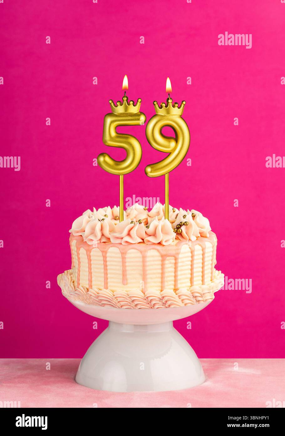 Number 59 birthday candle - Pink celebration cake with drip icing Stock ...