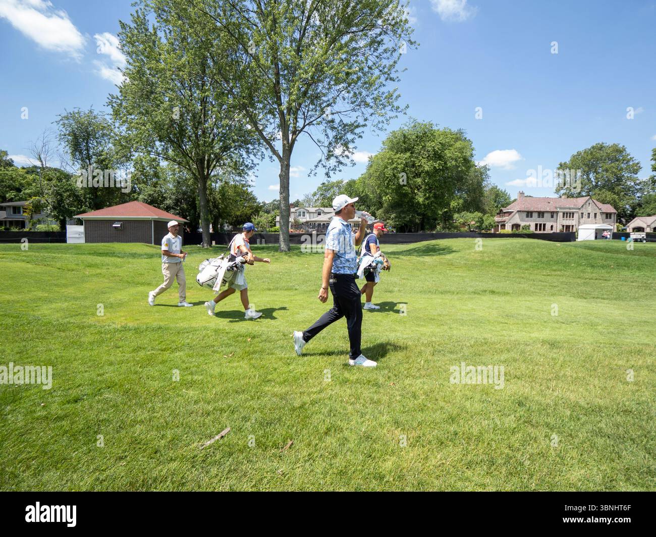 DETROIT, MI - JUNE 29: Kevin Roy (USA) walks the fairway with Chandler ...