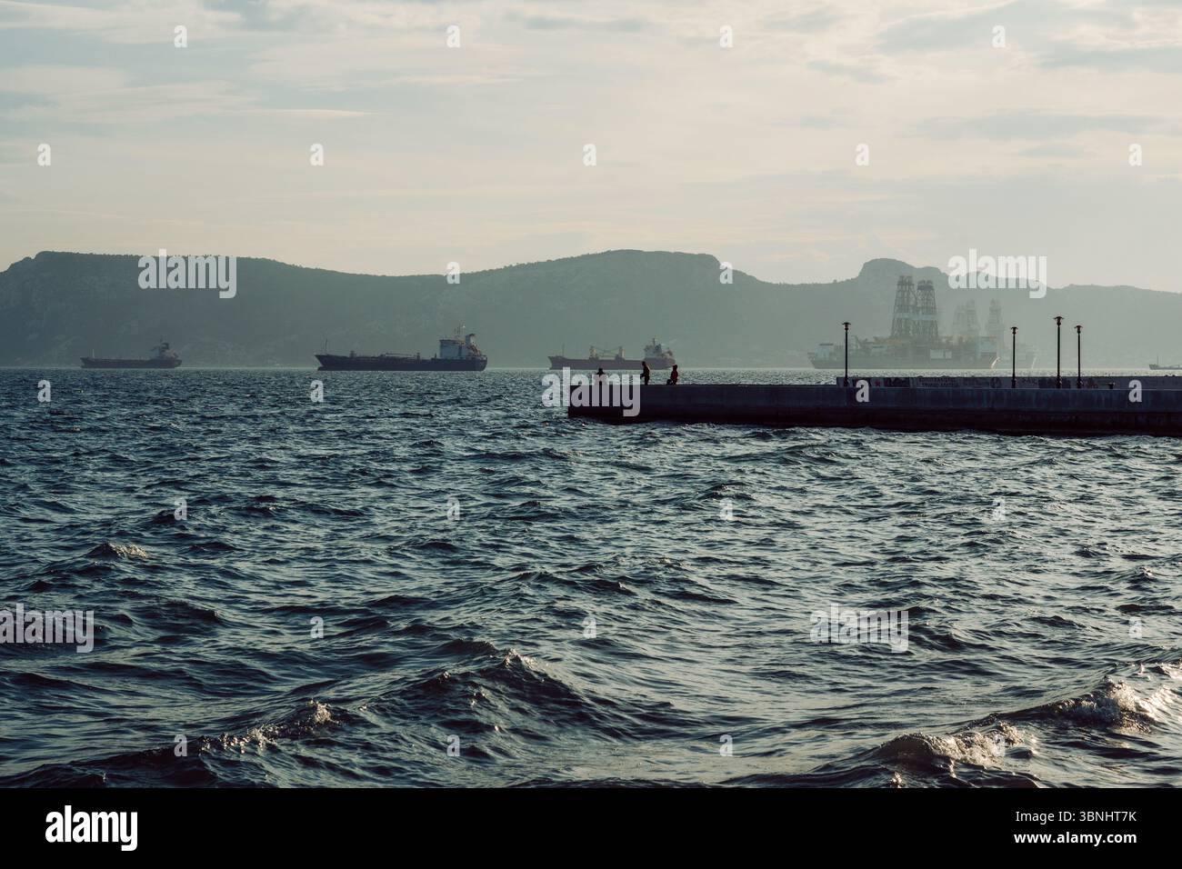 Turbulent waters in the port of Elefsina of Athens at dusk Stock Photo ...
