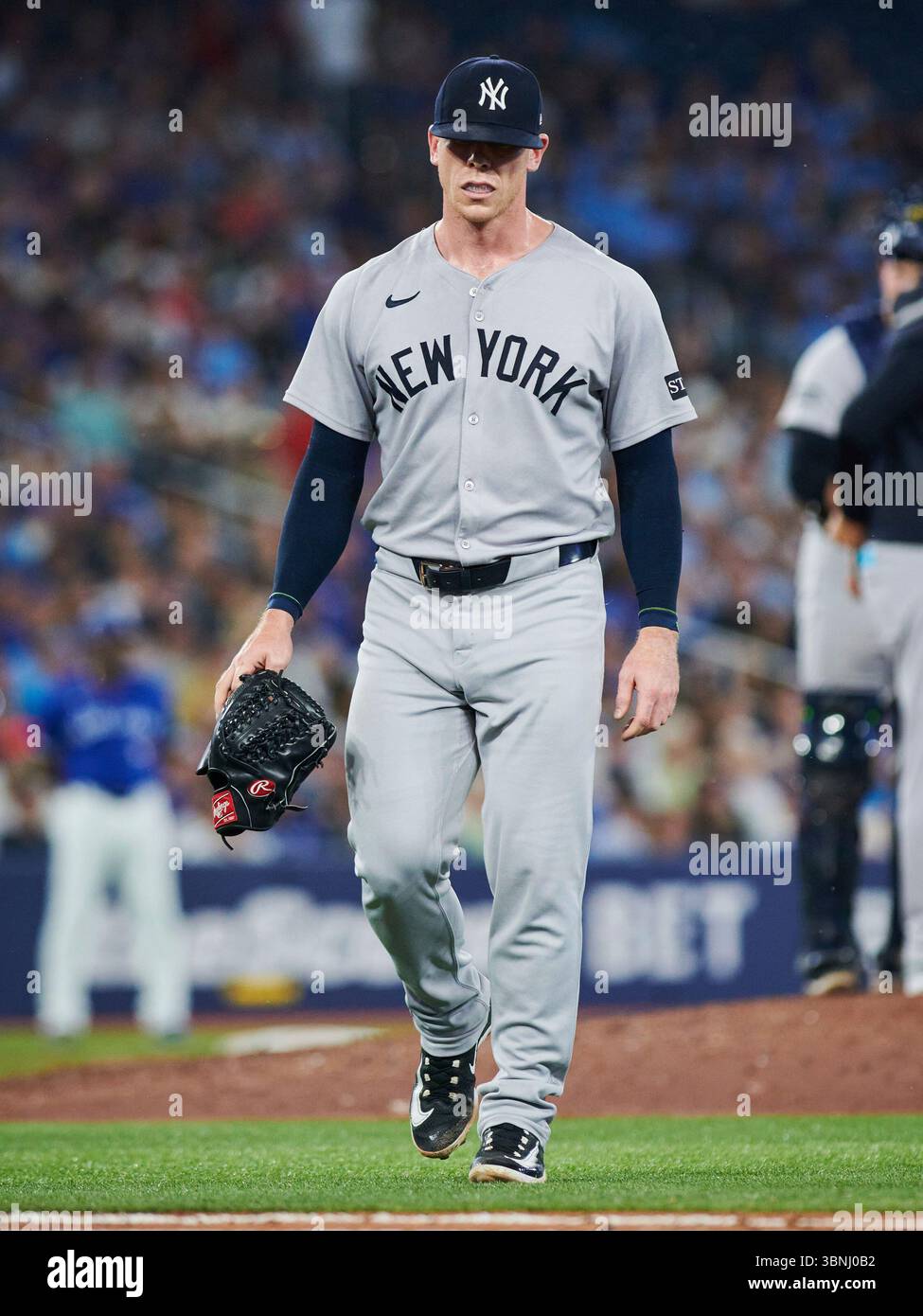 New York Yankees pitcher Ian Hamilton (71) reacts as he walks back to ...