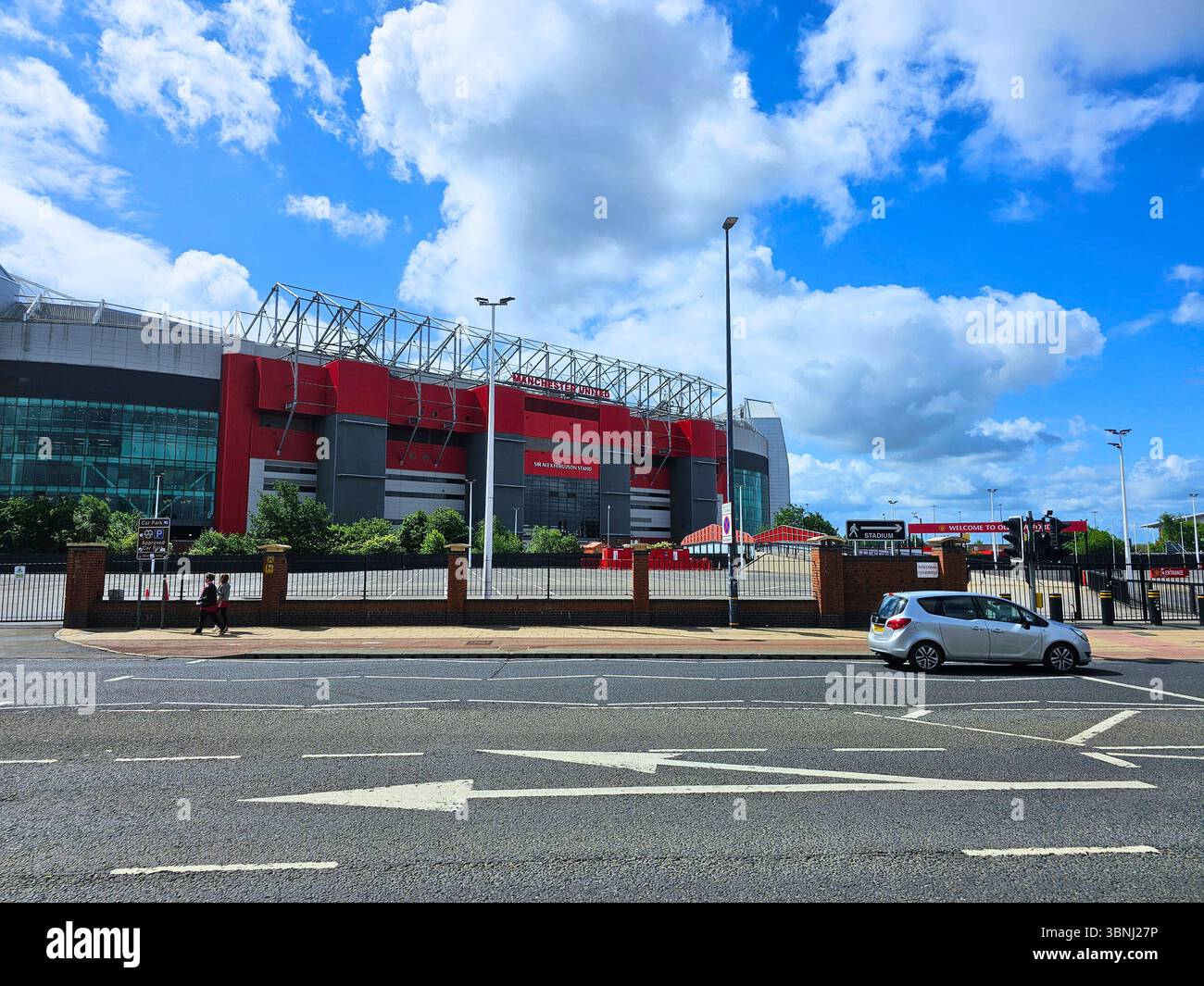 in front of Sir Alex Ferguson Stand Stock Photo - Alamy