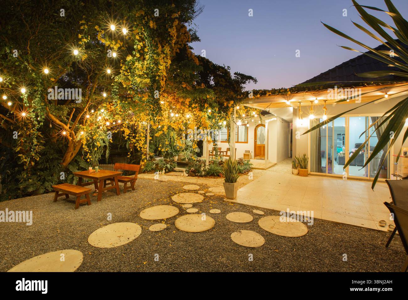 Tropical Garden with Koi Pond and Cozy Wooden Patio, A lush tropical ...