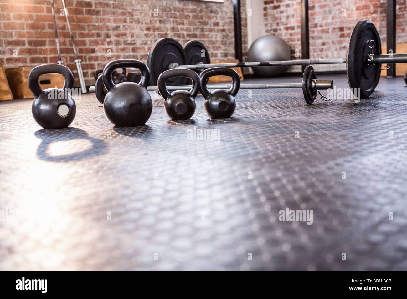 Lifting weights on sports equipment hi-res stock photography and images ...