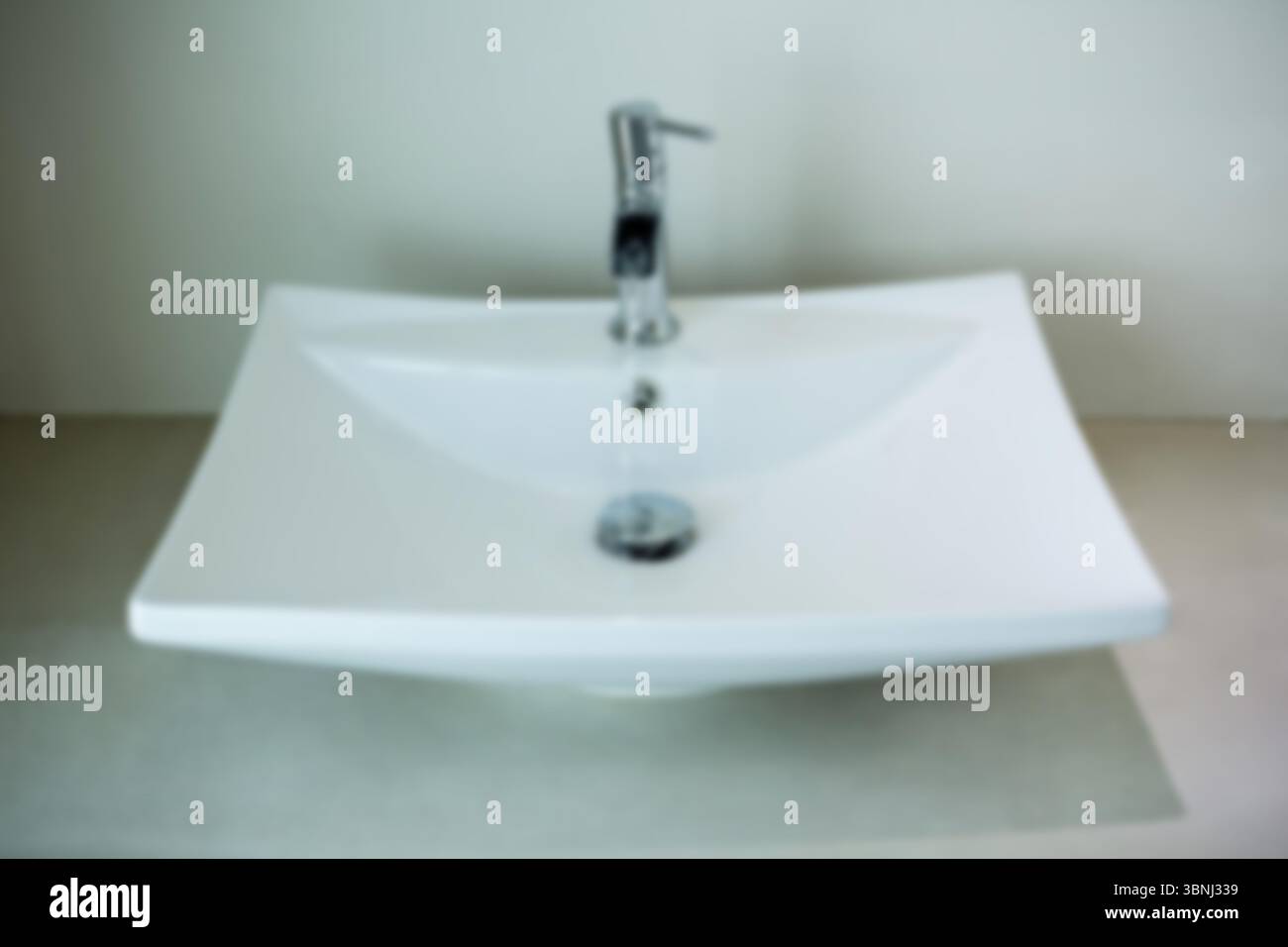Water running from faucet in wash basin Stock Photo - Alamy