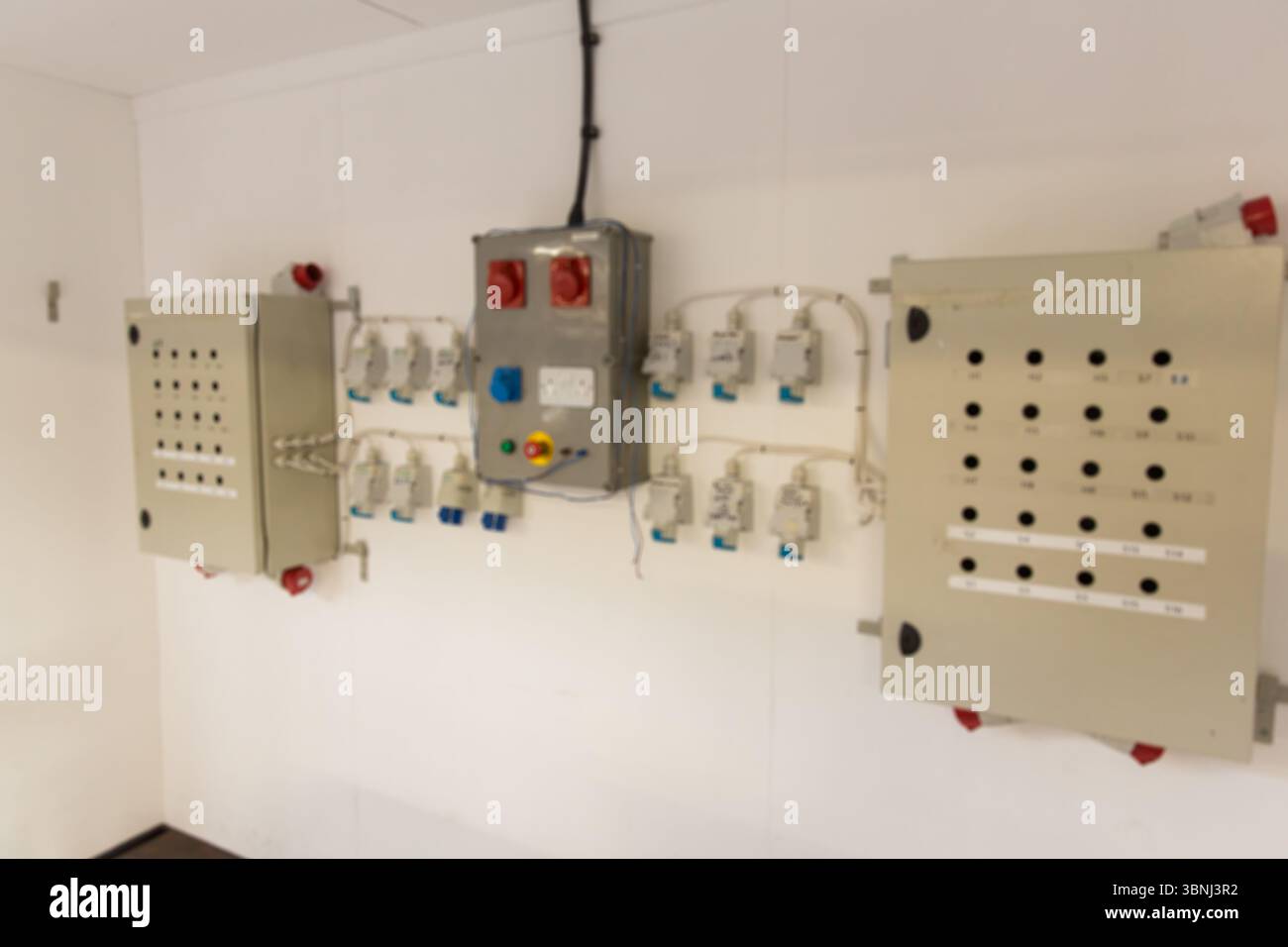 Flat design is showing three wall-mounted control panels on white wall with power outlets and ...