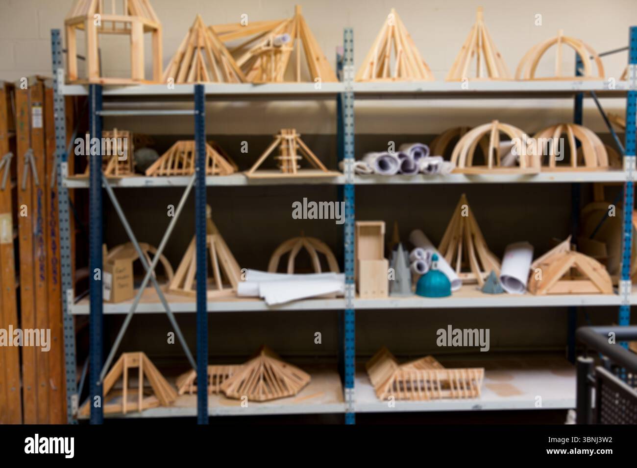 Flat design metal shelving unit is showing wooden architecture models ...