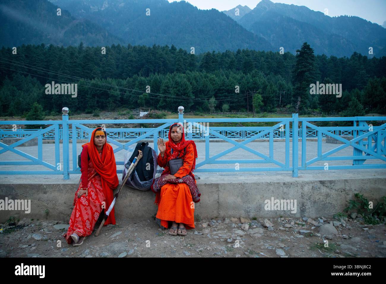 Hindu pilgrims rest alongside a road during the annual pilgrimage to ...
