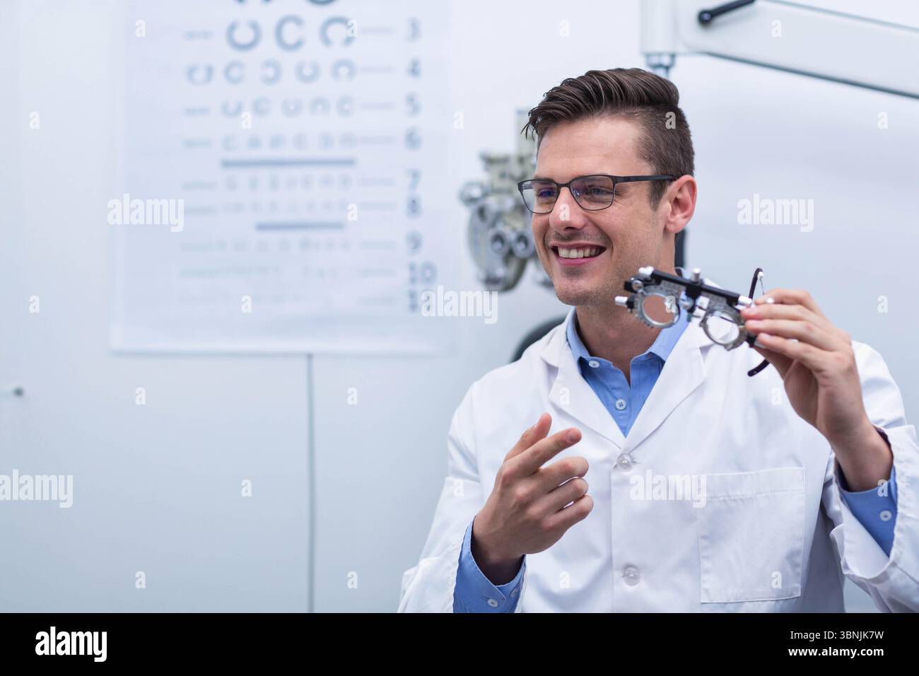 Trial frame sitting on exam table in optometry clinic, with phoropter ...