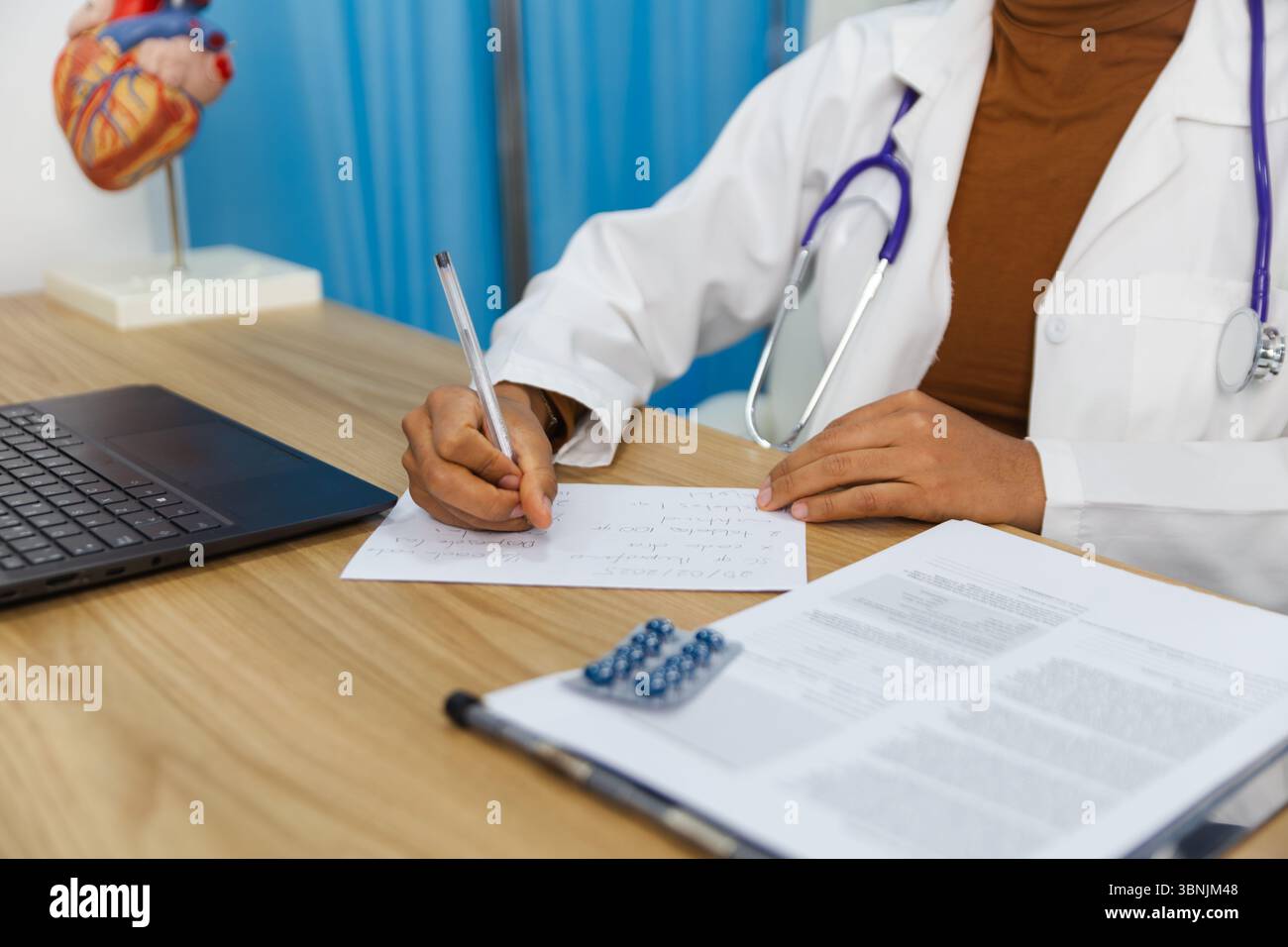 Doctor seen writing notes hi-res stock photography and images - Alamy