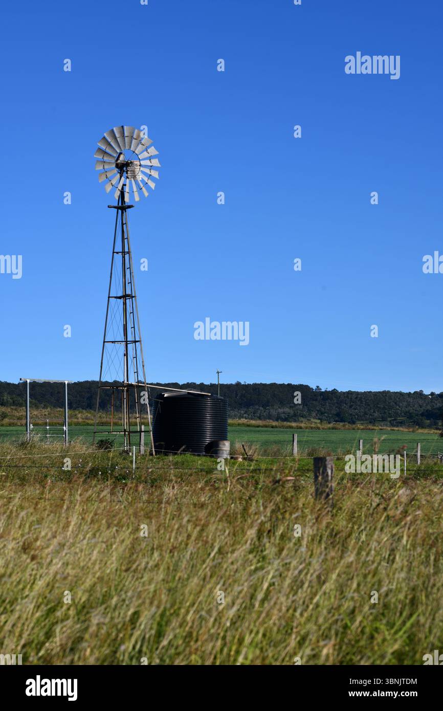 A traditional style windmill on a farm in the South Burnett district of ...