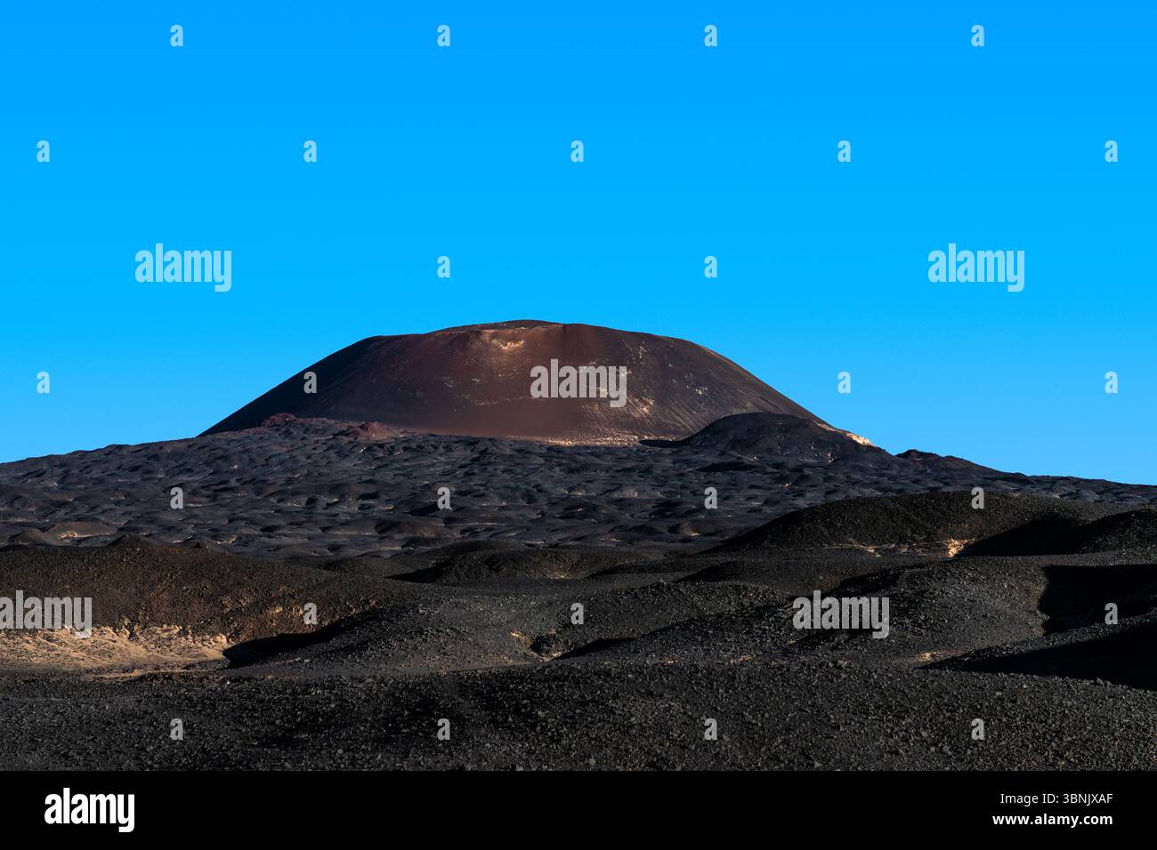 A striking view of Carachi Pampa Volcano under a clear blue sky ...