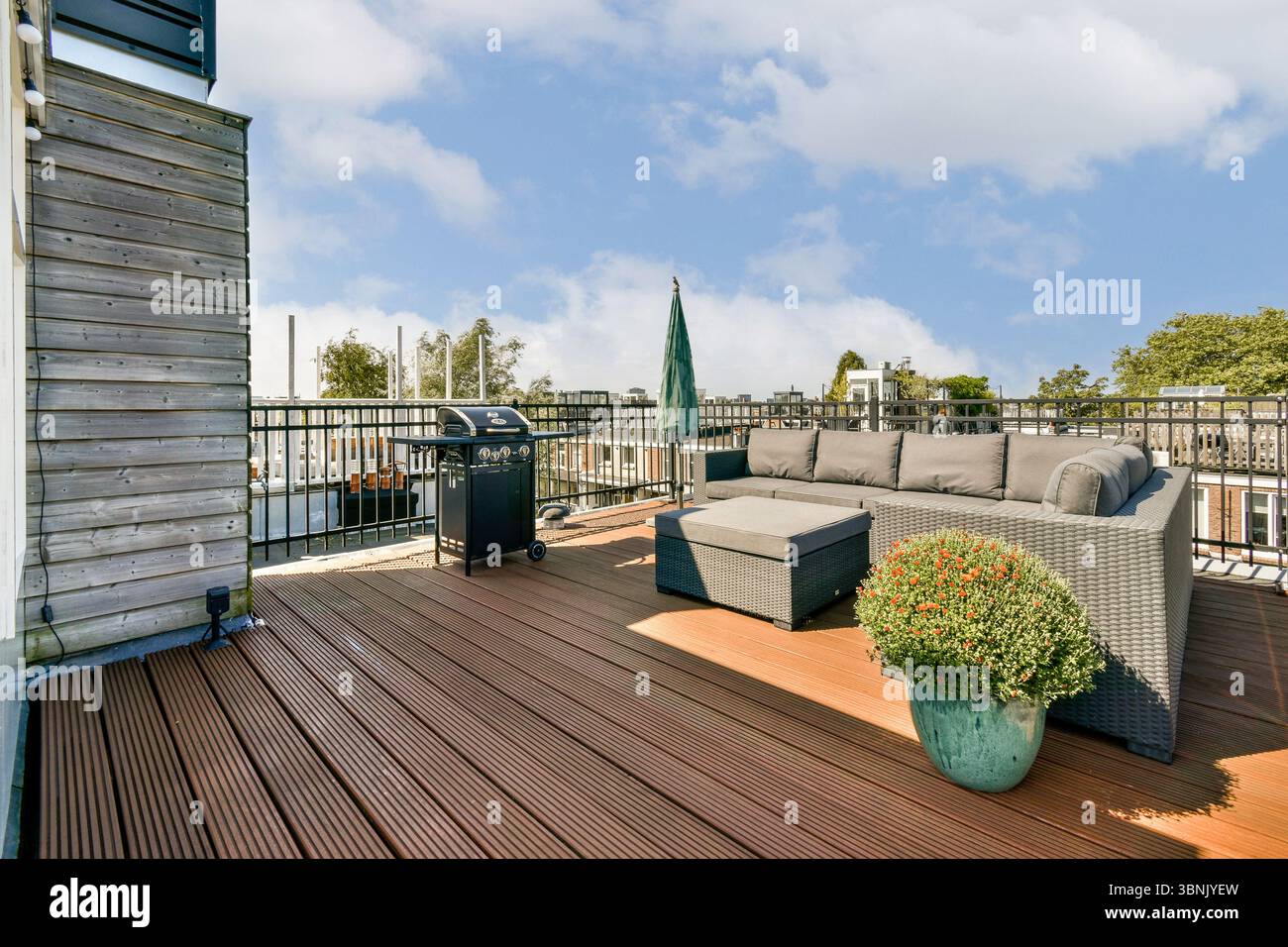 Stylish rooftop terrace featuring a comfortable seating arrangement ...