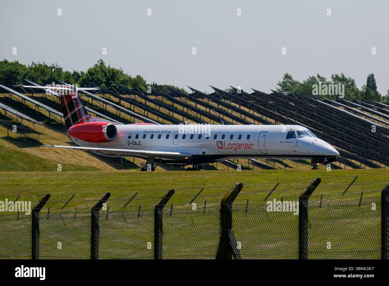 Loganair Embraer ERJ-145 G-SAJL lining up to take off from runway 15 at ...