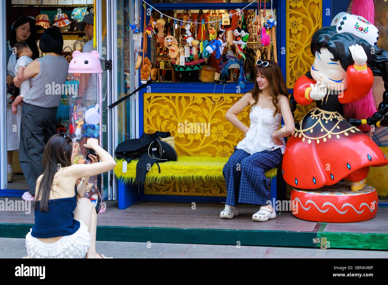 Tourists visit the Grand Bazaar in Urumqi City, northwest China's ...