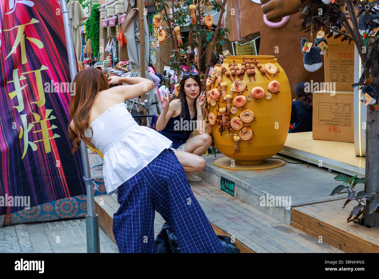 Tourists visit the Grand Bazaar in Urumqi City, northwest China's ...