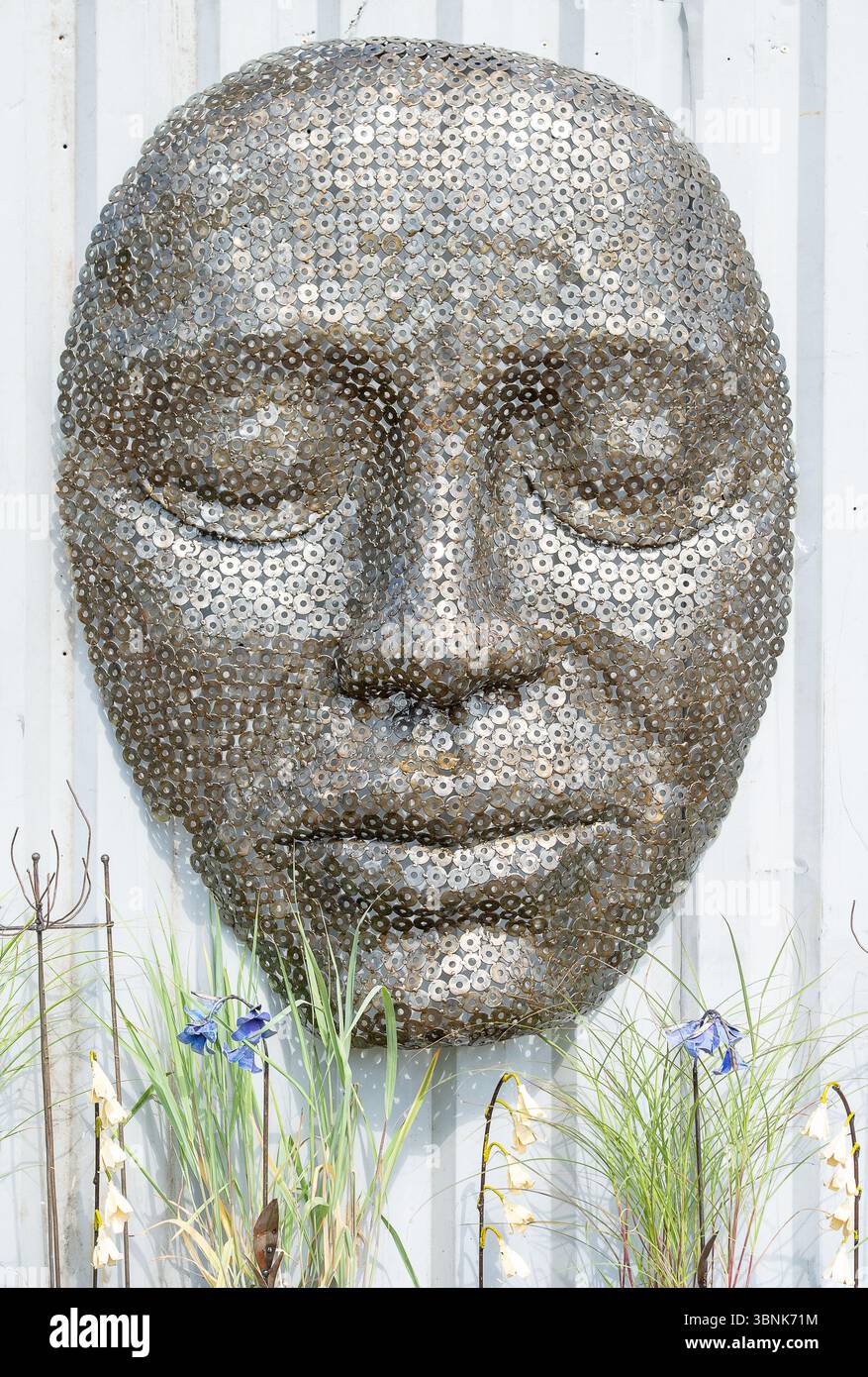 East Molesey, Surrey, UK. 30th June, 2025. A face sculpture for sale at ...