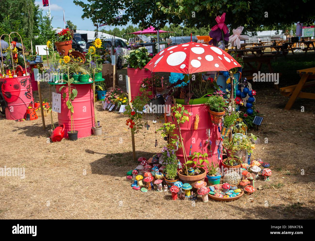 East Molesey, Surrey, UK. 30th June, 2025. Colourful School Bug Barrels ...