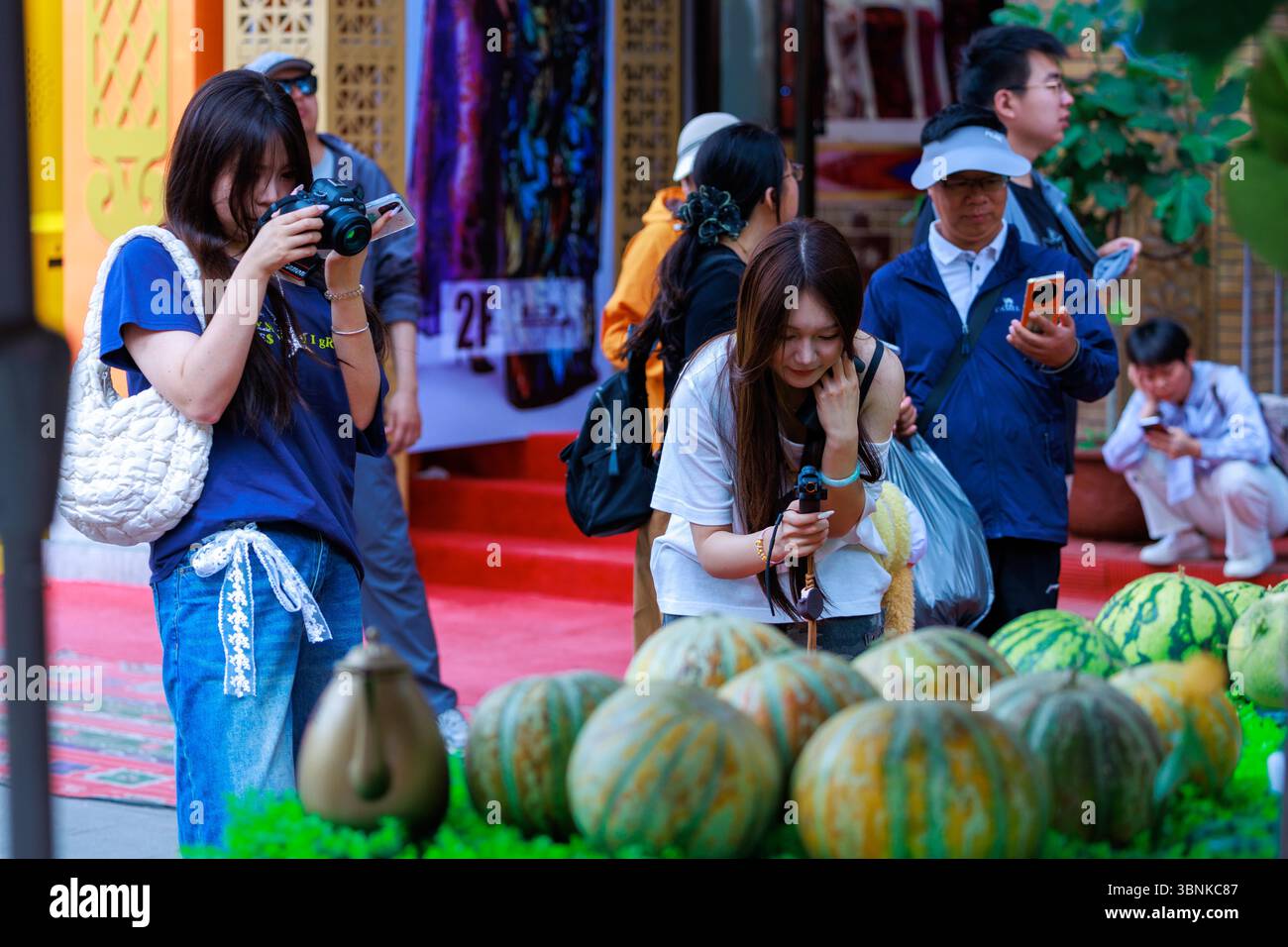 Tourists visit the Grand Bazaar in Urumqi City, northwest China's ...