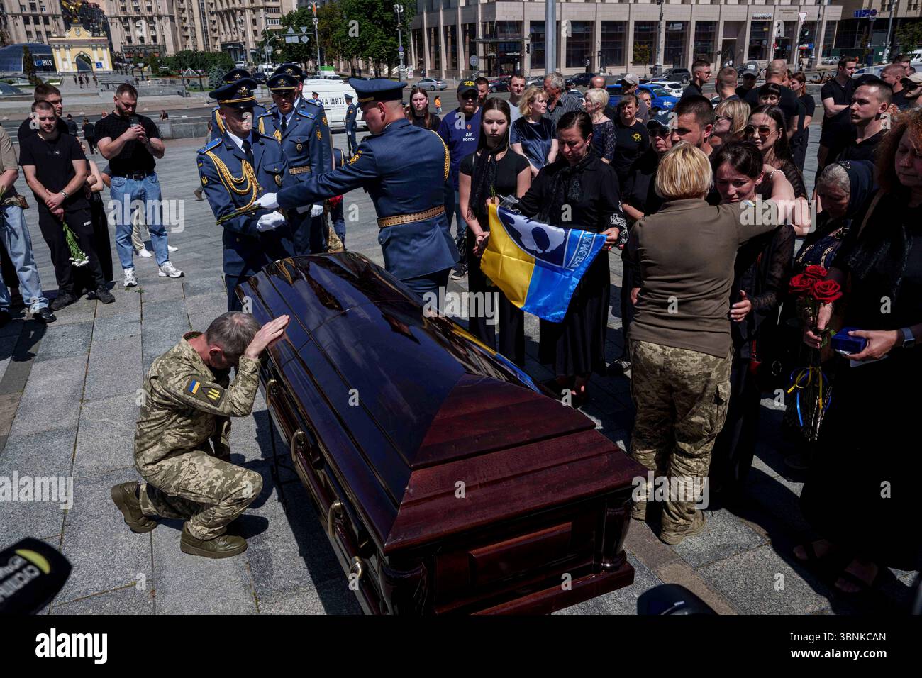 A Ukrainian serviceman says goodbye to Ukrainian F-16 pilot Maksym ...