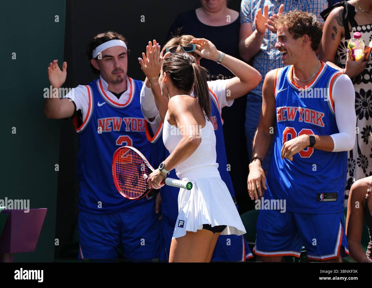 Emma Navarro gifts her towel to fans following her victory over ...