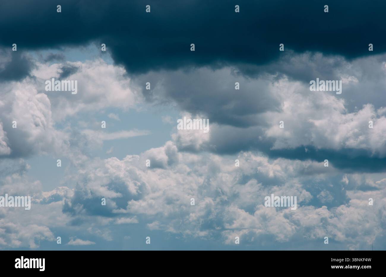 Dark storm clouds with rain. Storm clouds of various soft shapes in the ...
