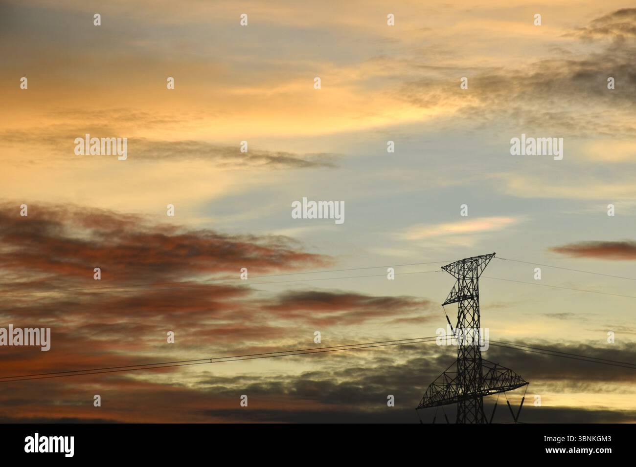 high voltage electric pole on twilight sunset sky in evening Stock ...