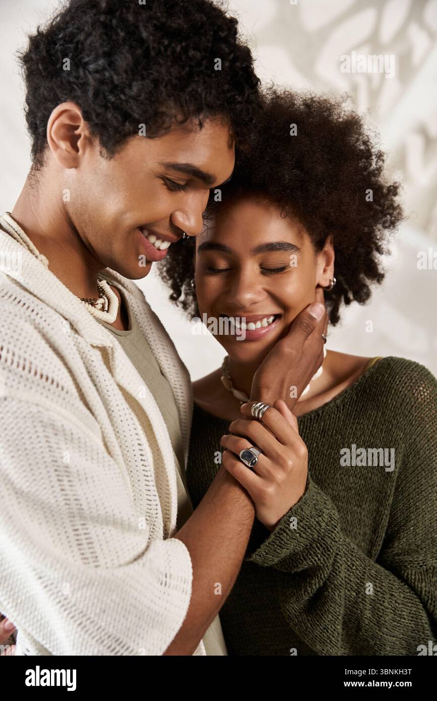 Two young lovers embrace joyfully, showcasing their deep connection in ...
