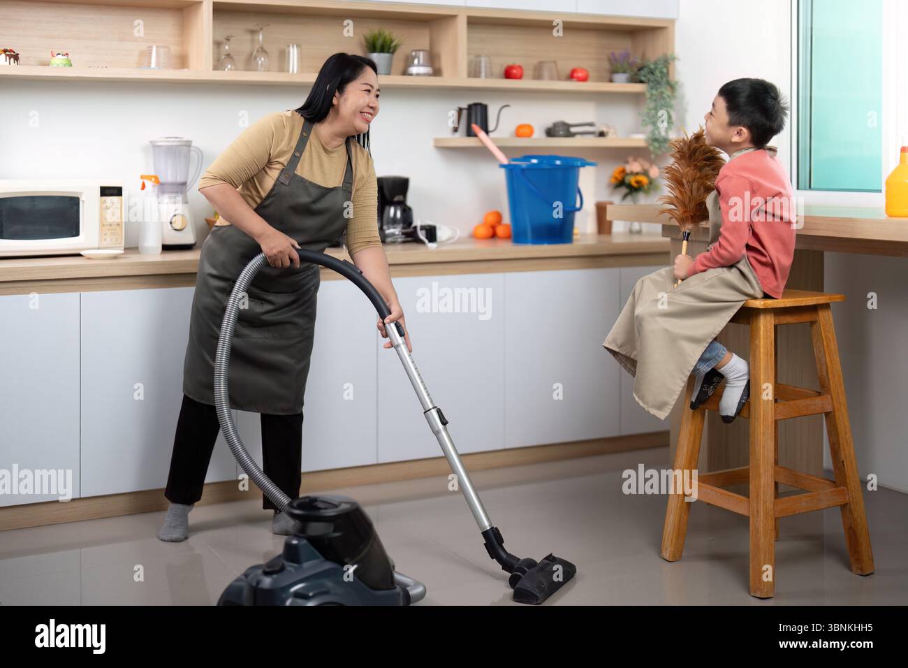 Mother and Son Cleaning Together. Joyful moments of family bonding ...