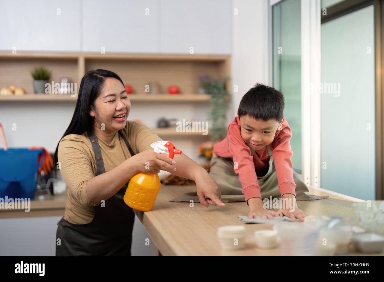 Mother and Son Cleaning Together. Joyful moments of family bonding ...