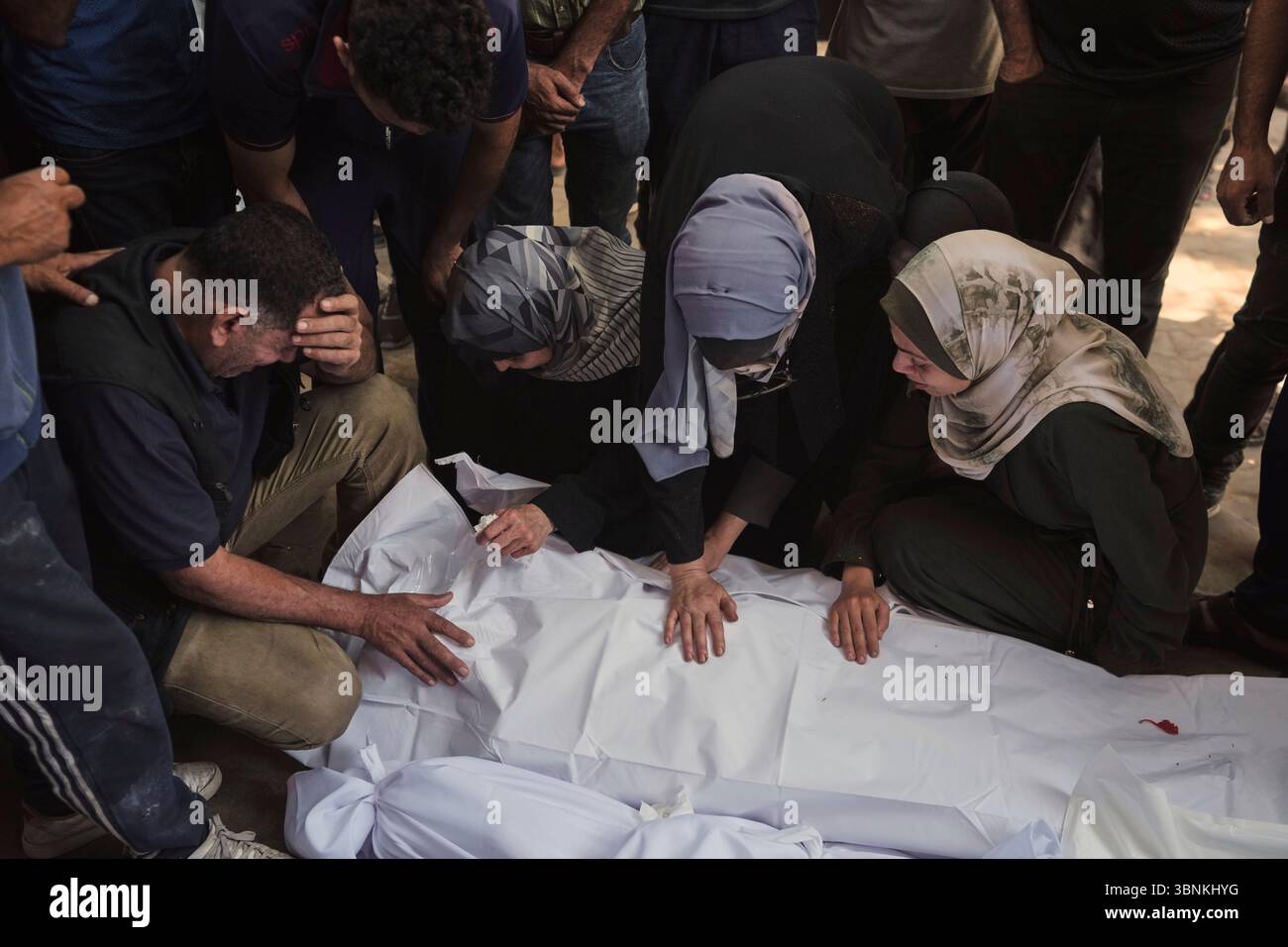 Mourners bids farewell to their relatives, Duha Hajila and her three ...