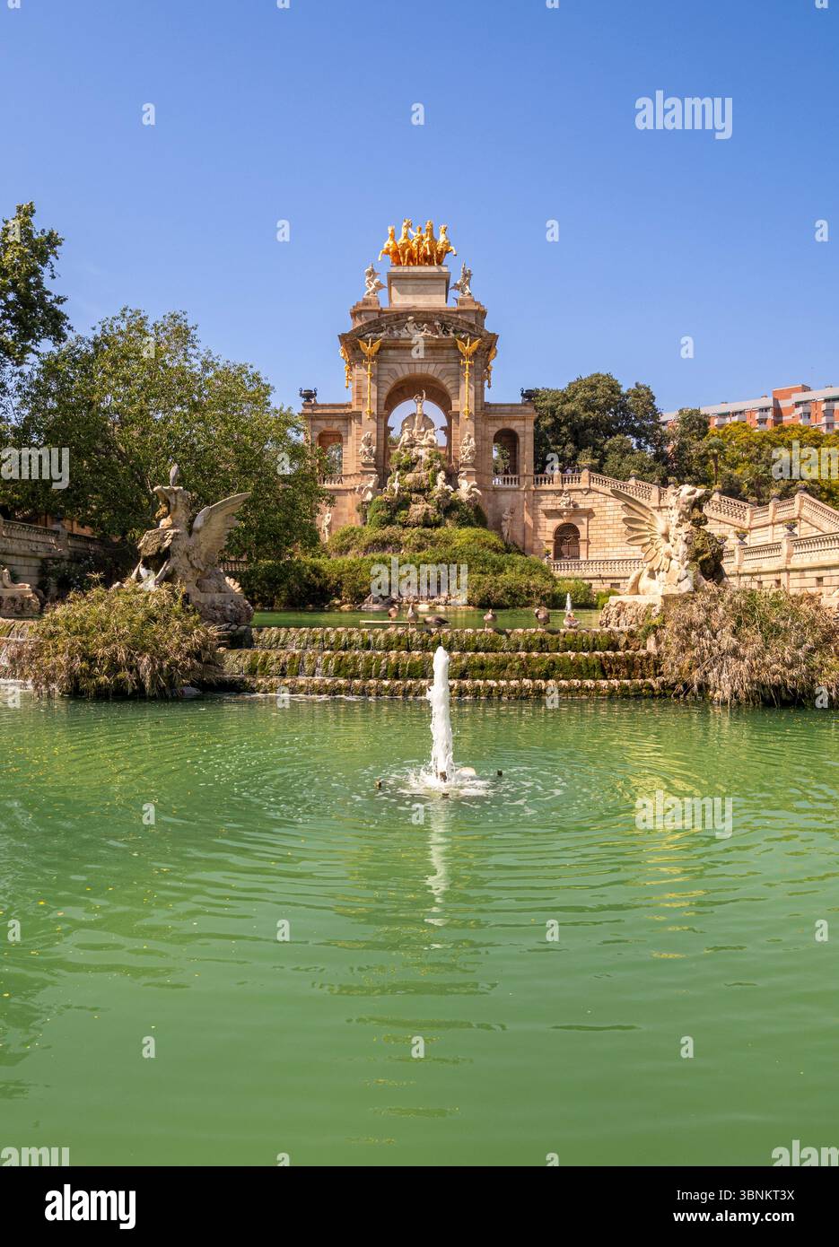The impressive Cascada Monumental stands at the end of a lake in Parc ...