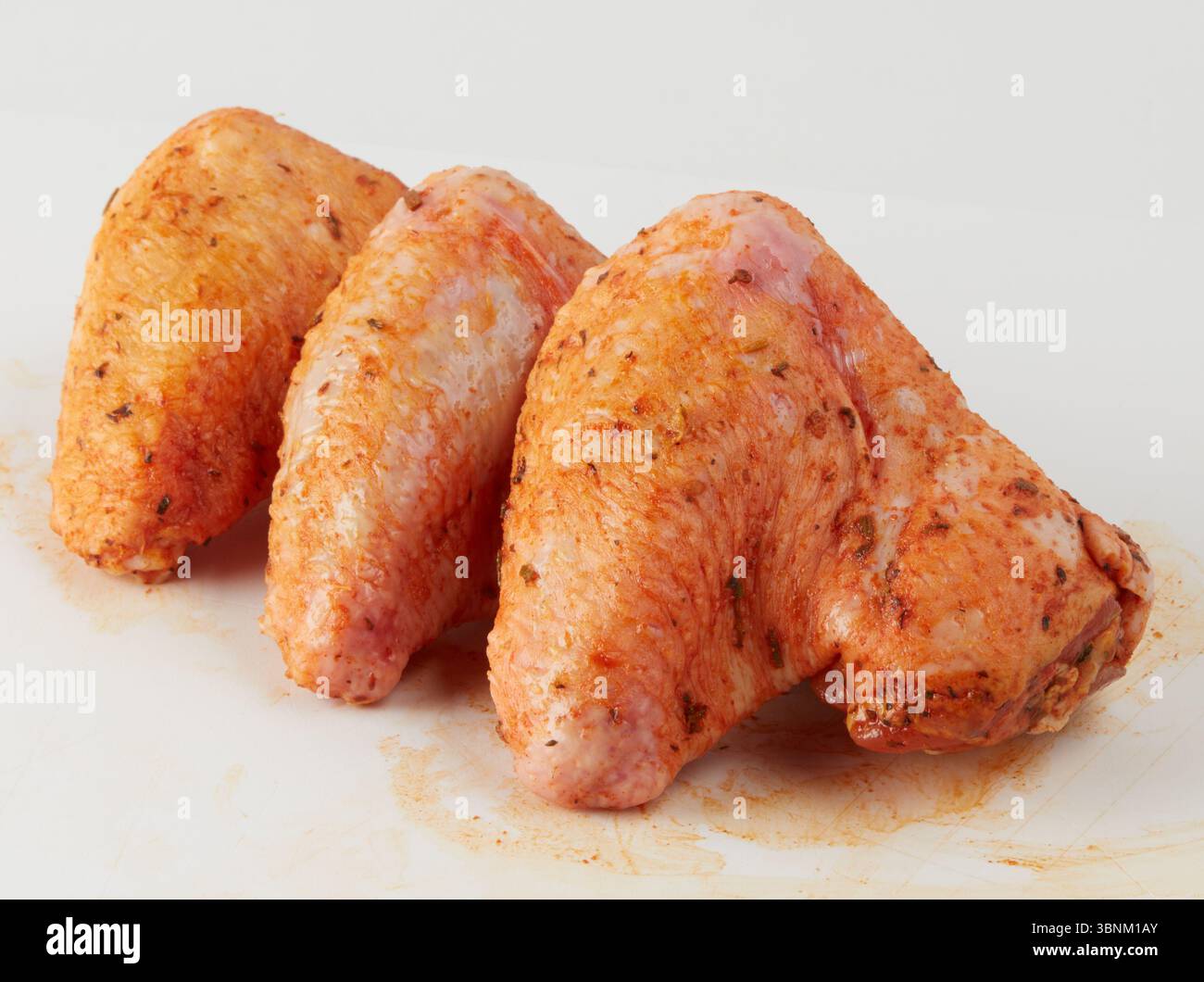 Rubber 3 chicken wings stacked in rows Stock Photo - Alamy