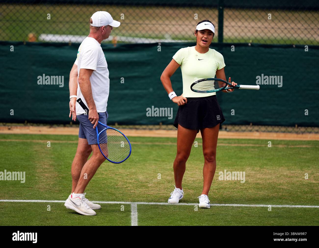 Emma Raducanu with her coach Mark Petchey during a practice session on ...