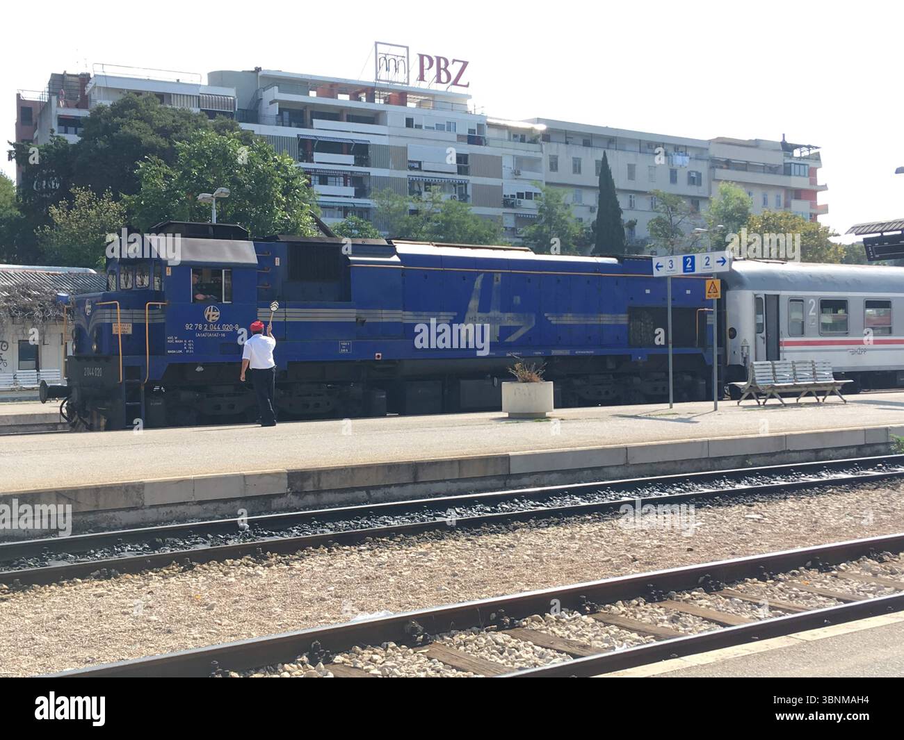 Regional trains sit at Split’s historic main railway station, framed by ...