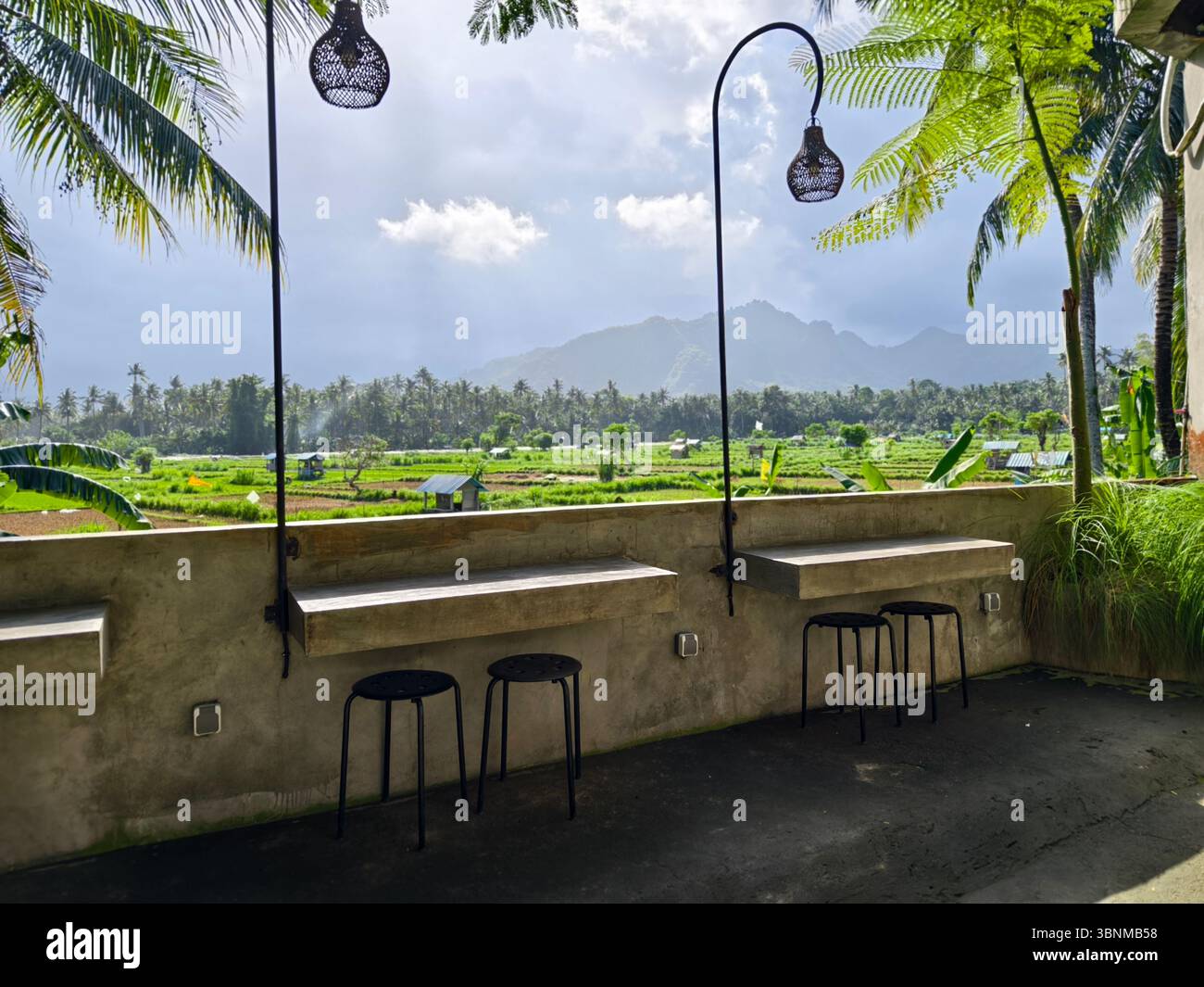 An open-air cafe space with minimalist concrete seating and a view of ...