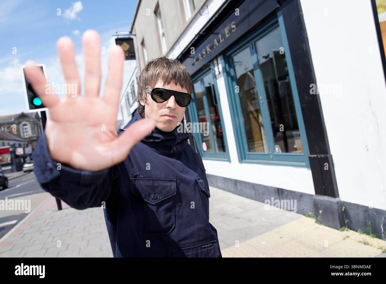 EDITORIAL USE ONLY Liam Gallagher lookalike Glen Moss surprises locals ...