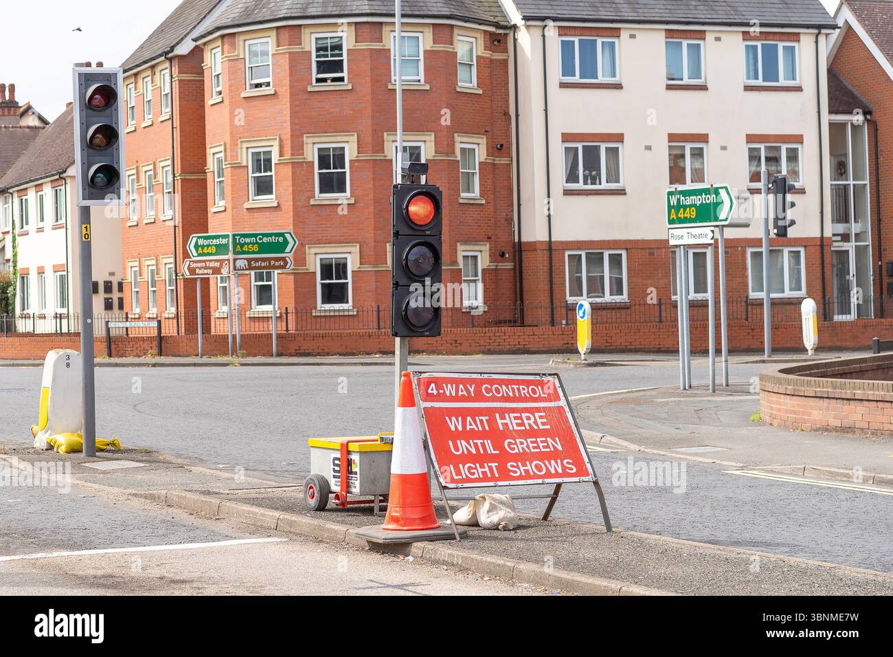 Close up view of temporary 4-way control traffic lights at a traffic ...