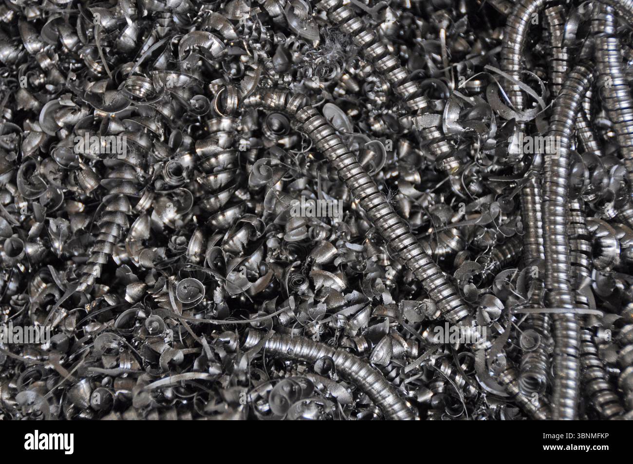 Steel turning chips from the lathe Stock Photo - Alamy