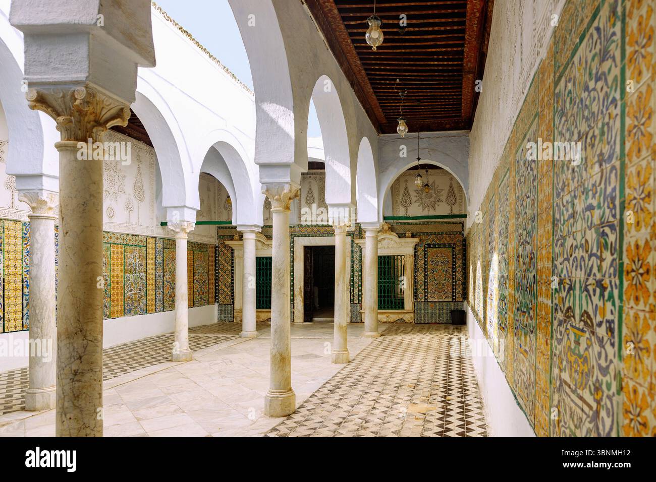 Colonnade decorated with colorful tiles and inner courtyard of the ...