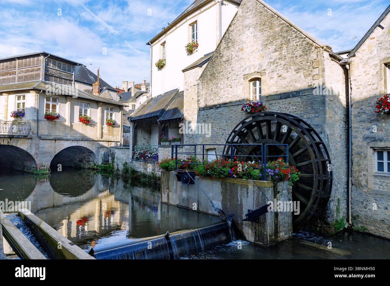 Old town of Bayeux with mill and stone bridge on the river l'Aure and ...