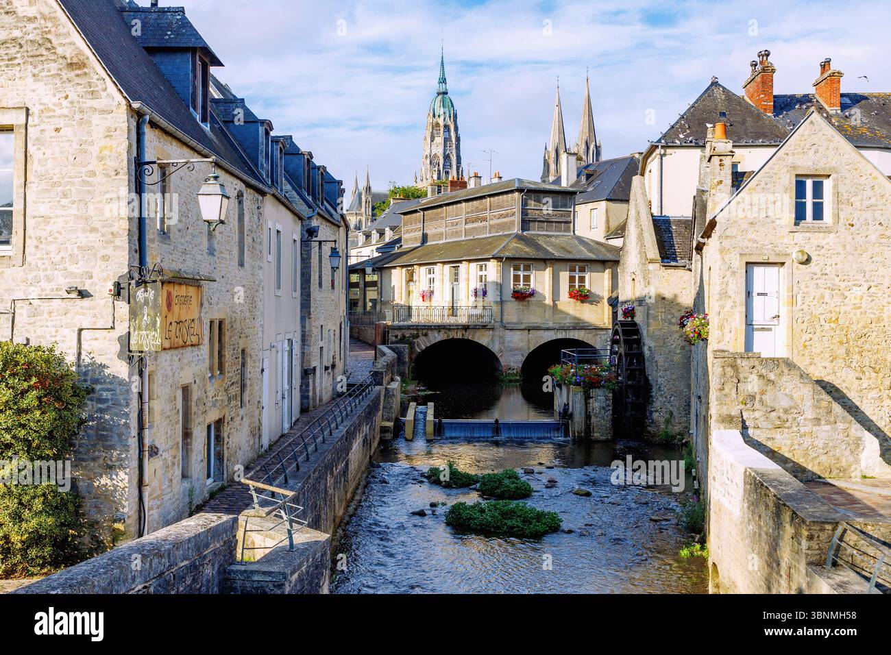 Old town of Bayeux with mill and stone bridge on the river l'Aure and ...