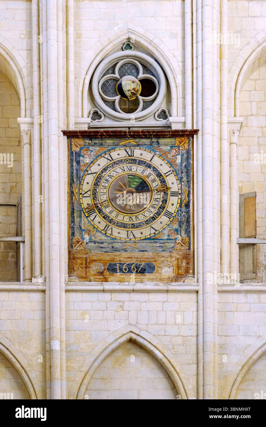 Historic clock with tide display in the church Abbatiale de la Sainte-Trinite (Ste-Trinite) in ...