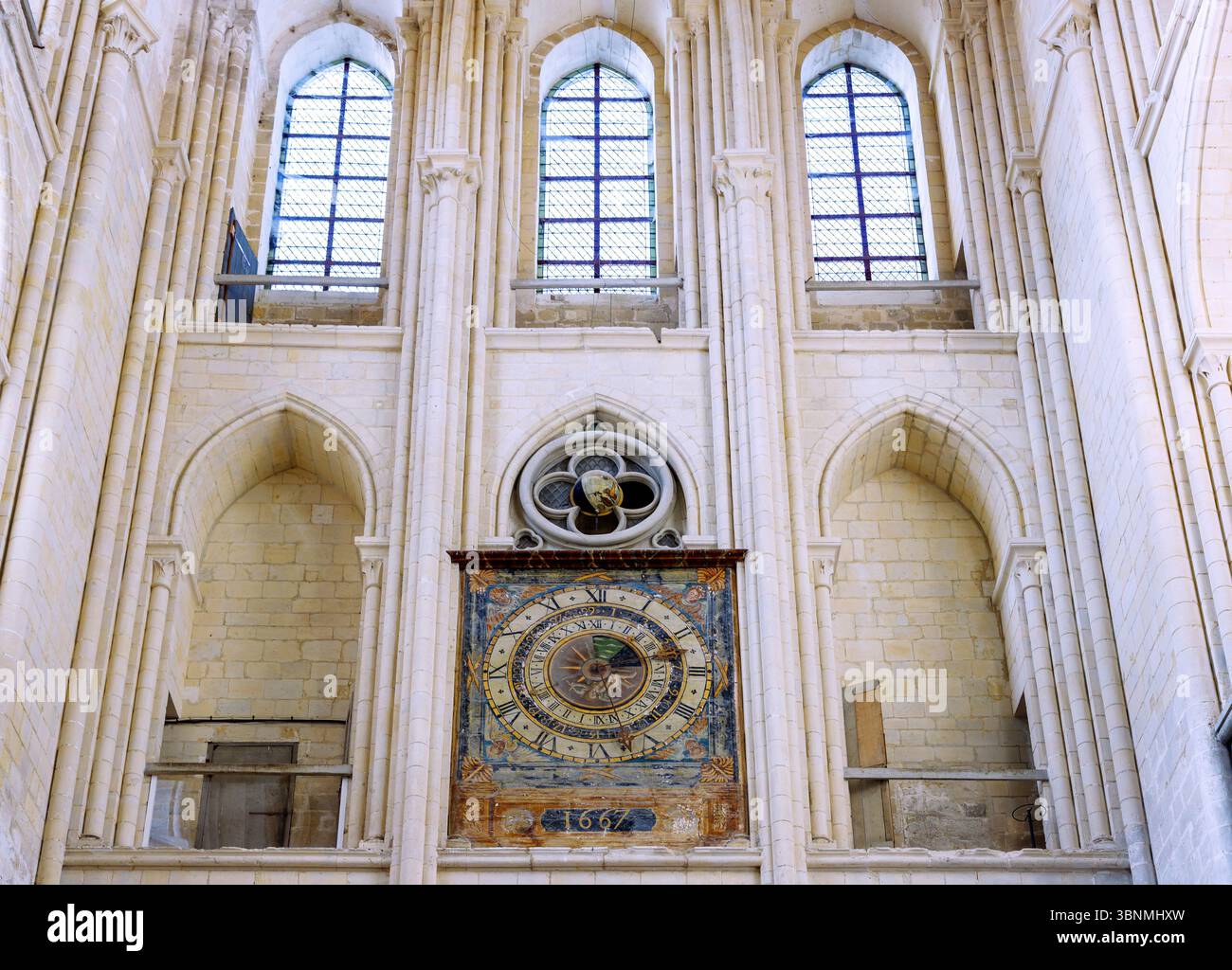 Historic clock with tide display in the church Abbatiale de la Sainte ...