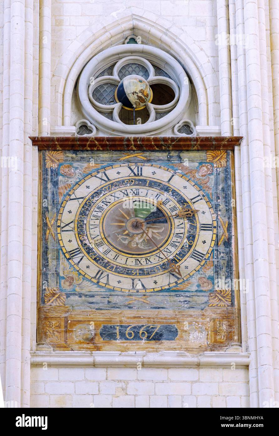 Historic clock with tide display in the church Abbatiale de la Sainte-Trinite (Ste-Trinite) in ...