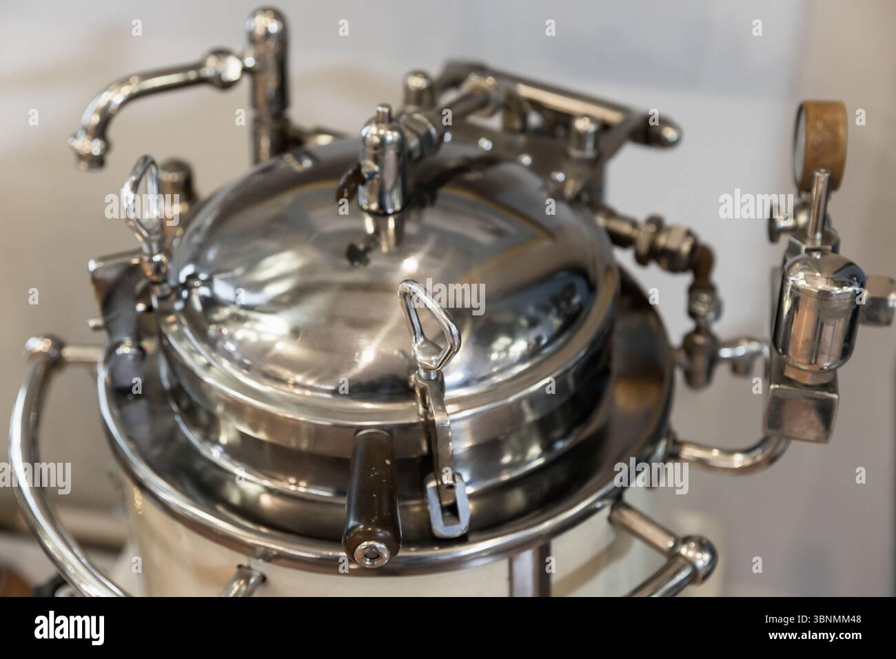 Intricate vintage metal machine featuring industrial elements, polished ...