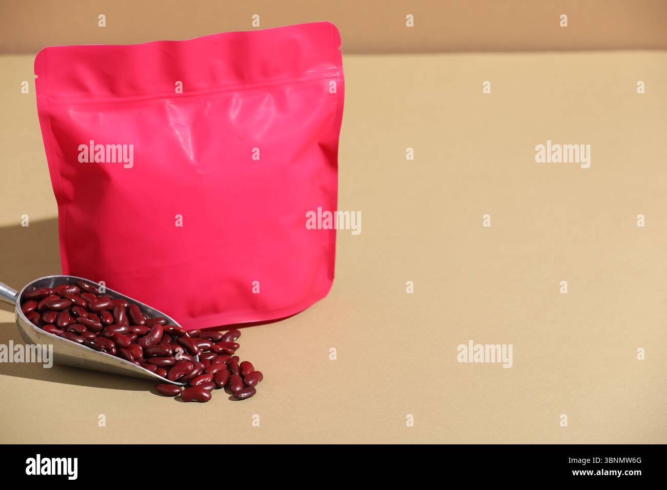 Zipper stand-up pouch and dry kidney beans on beige background, mockup ...