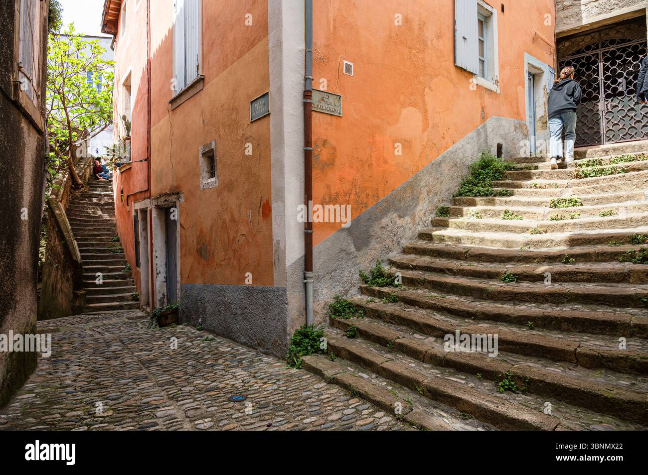 Narrow alley and stairs in the old town of crest hi-res stock ...