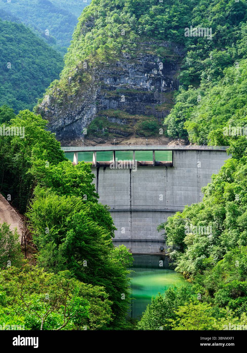 Italy, dam wall of the Lago di San Colombano above Trambileno Stock ...